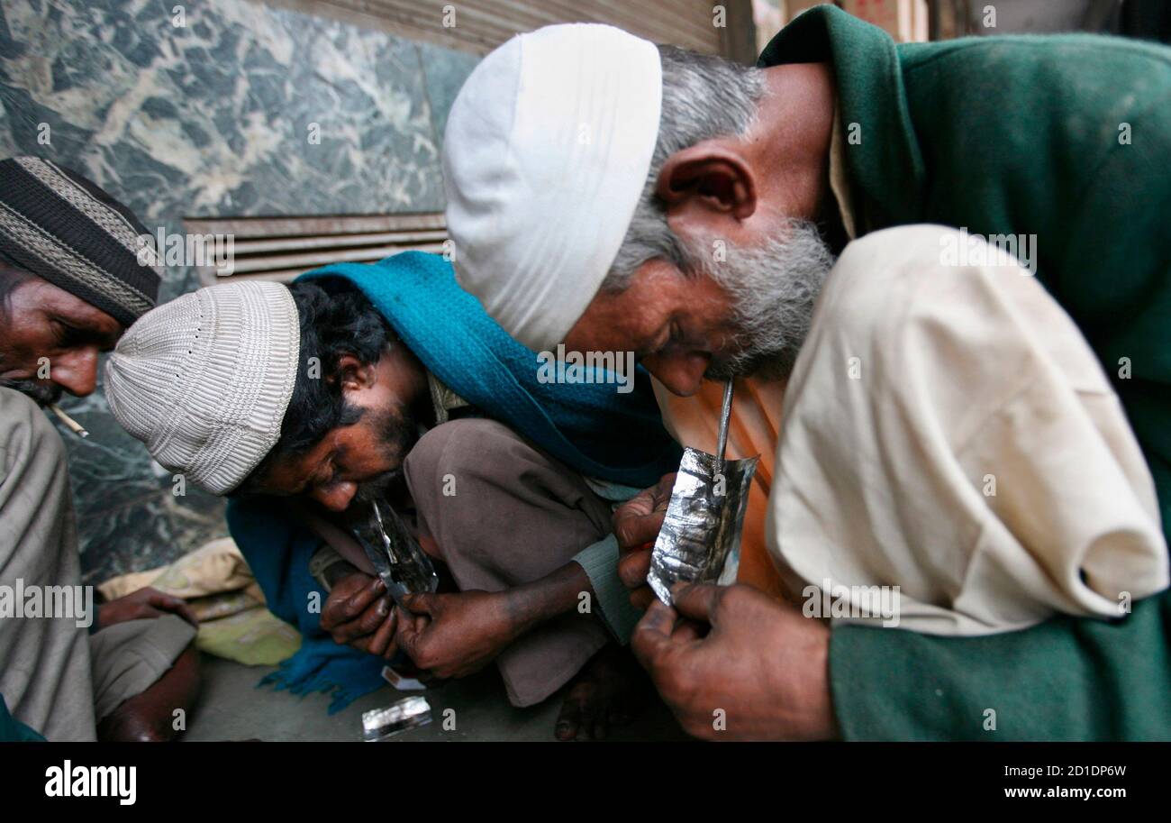 Drug addicts smoke heroin in hi-res stock photography and images - Alamy