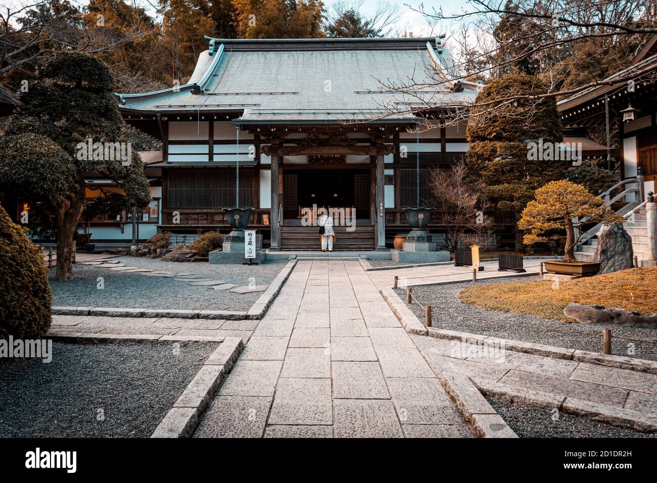 Praying at a temple in Japan Stock Photo - Alamy