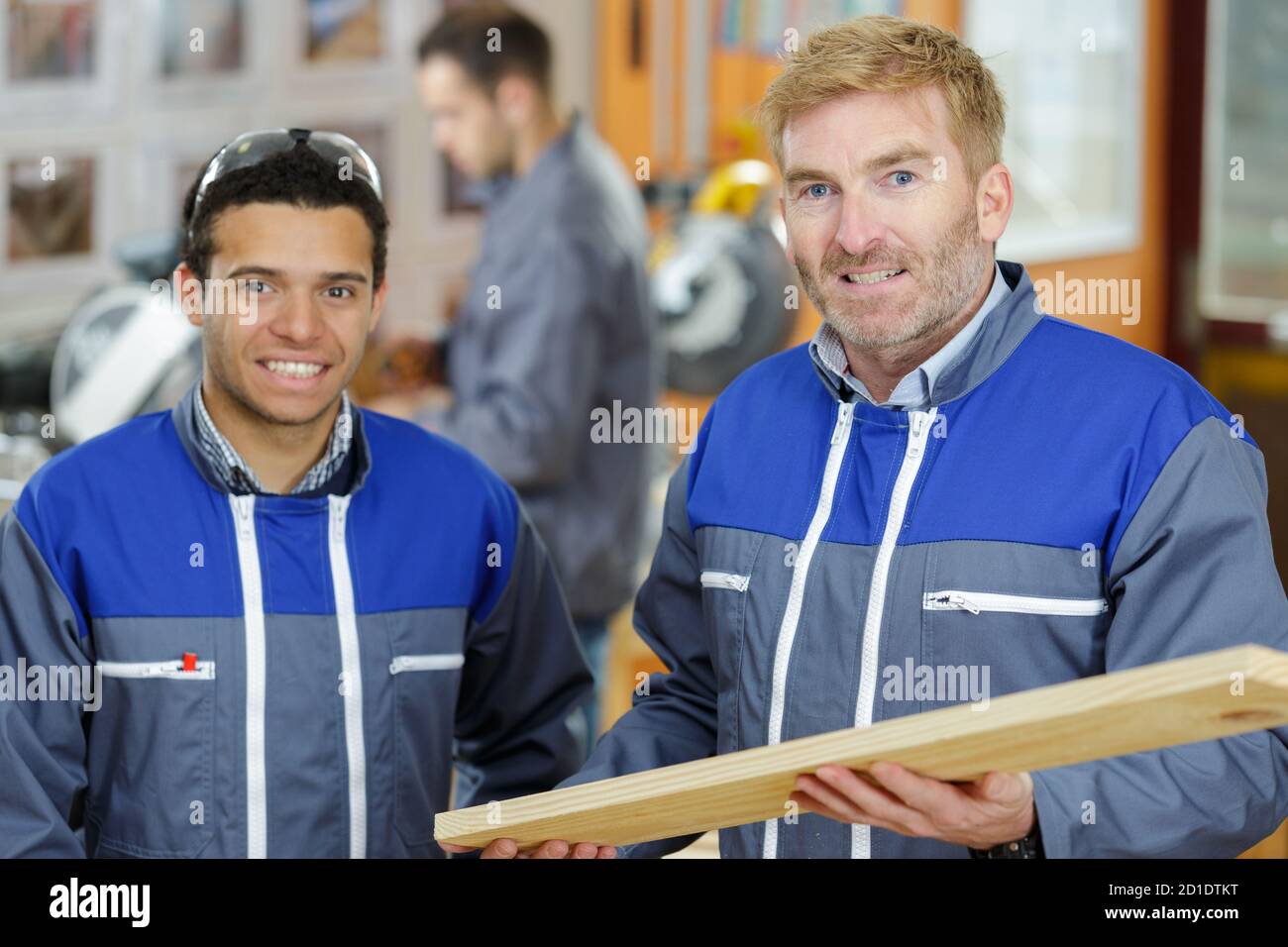 industrial woodworker posing and smiling Stock Photo - Alamy