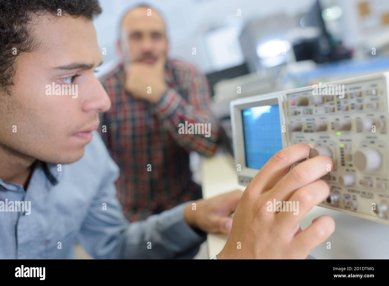 apprentice and teacher in studio Stock Photo - Alamy