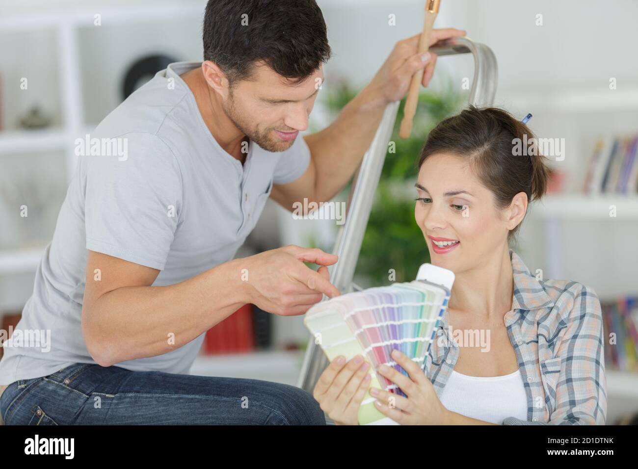 couple choosing from color swatches Stock Photo - Alamy