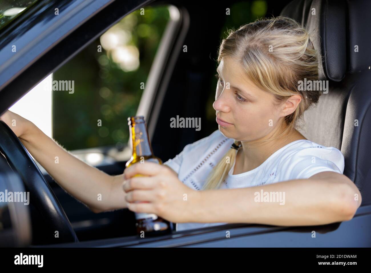 Drunk woman driving car beer hi-res stock photography and images - Alamy