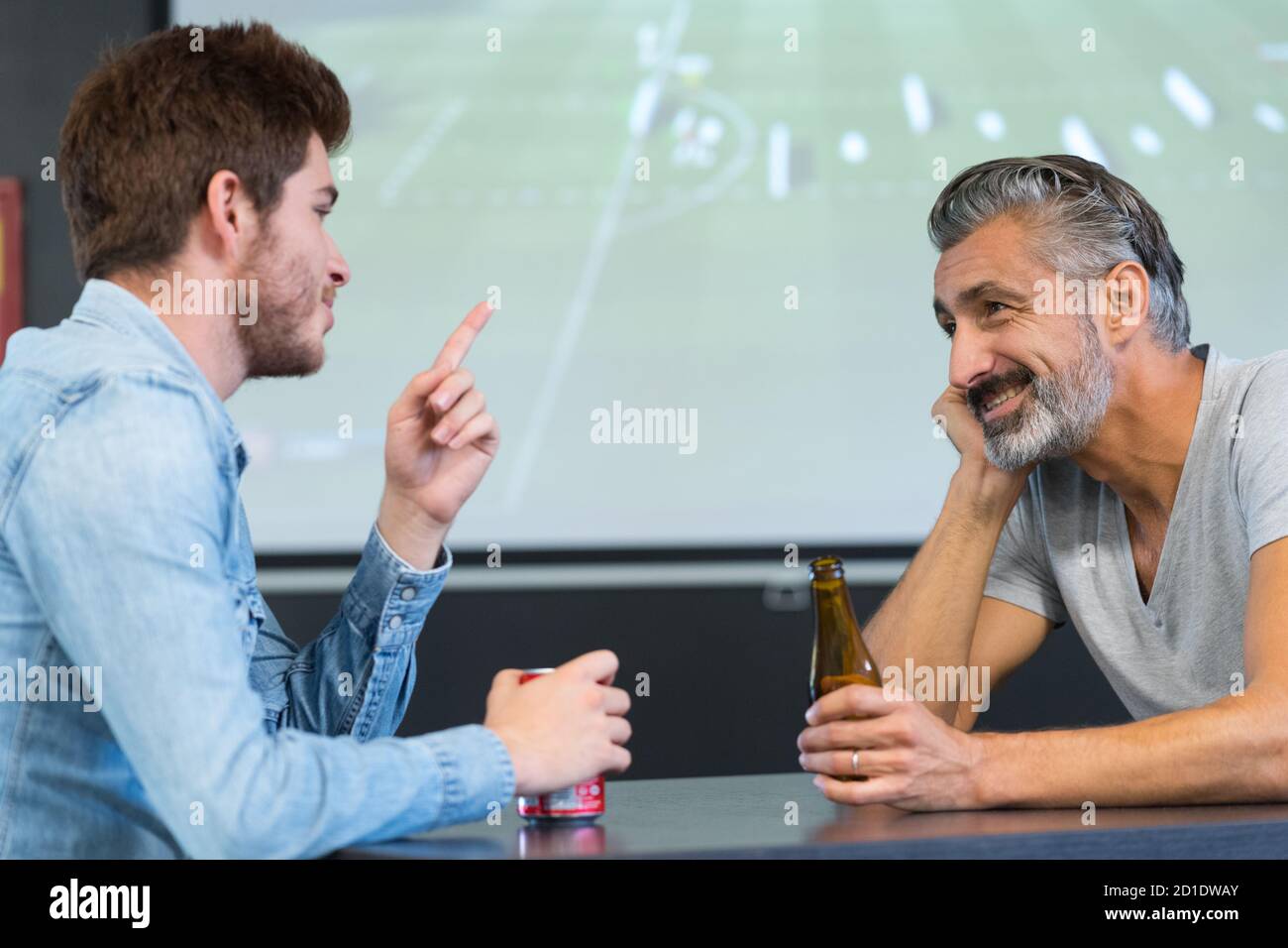 portrait of men having a conversation Stock Photo - Alamy