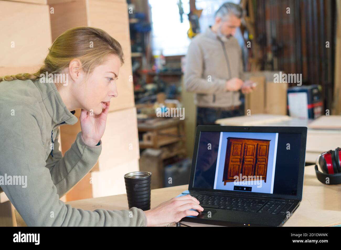 female worker checking a furniture in computer screen Stock Photo - Alamy