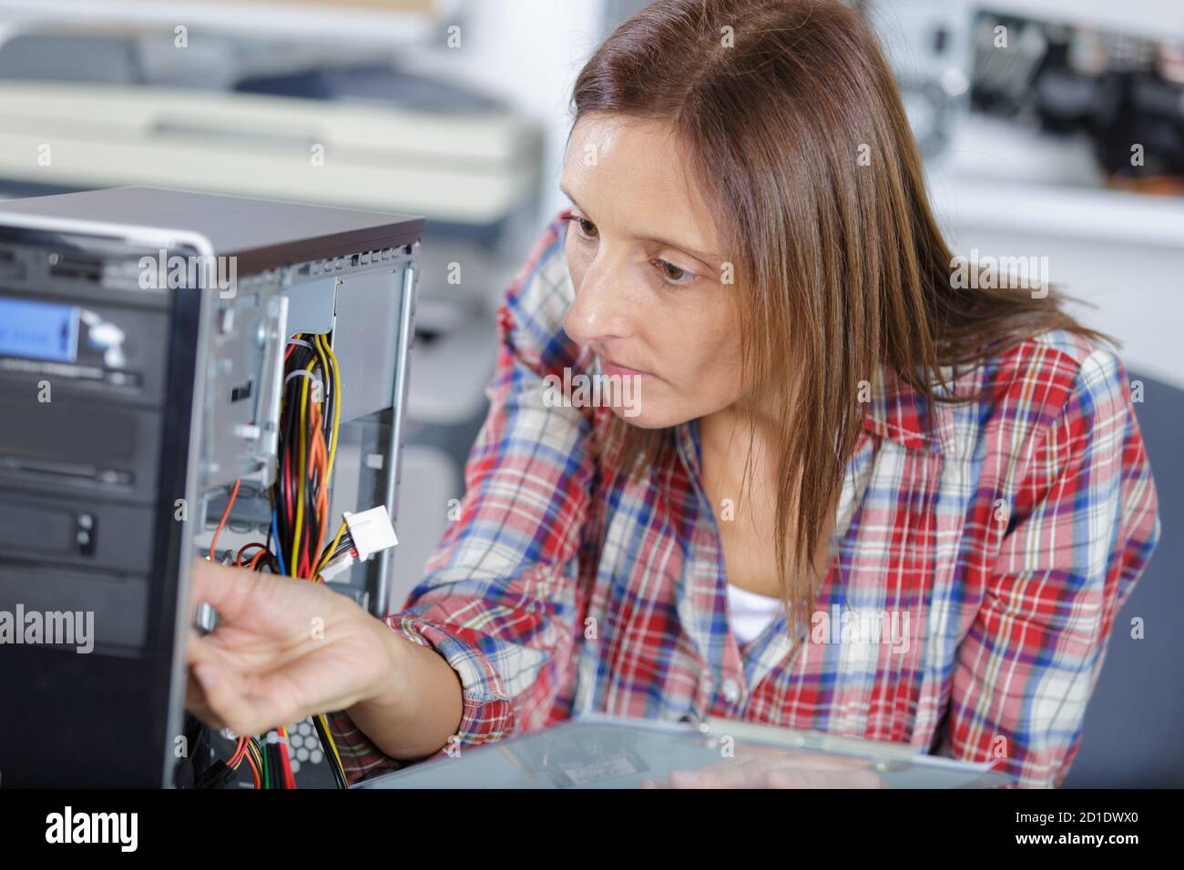 woman fix pc component in service center Stock Photo - Alamy