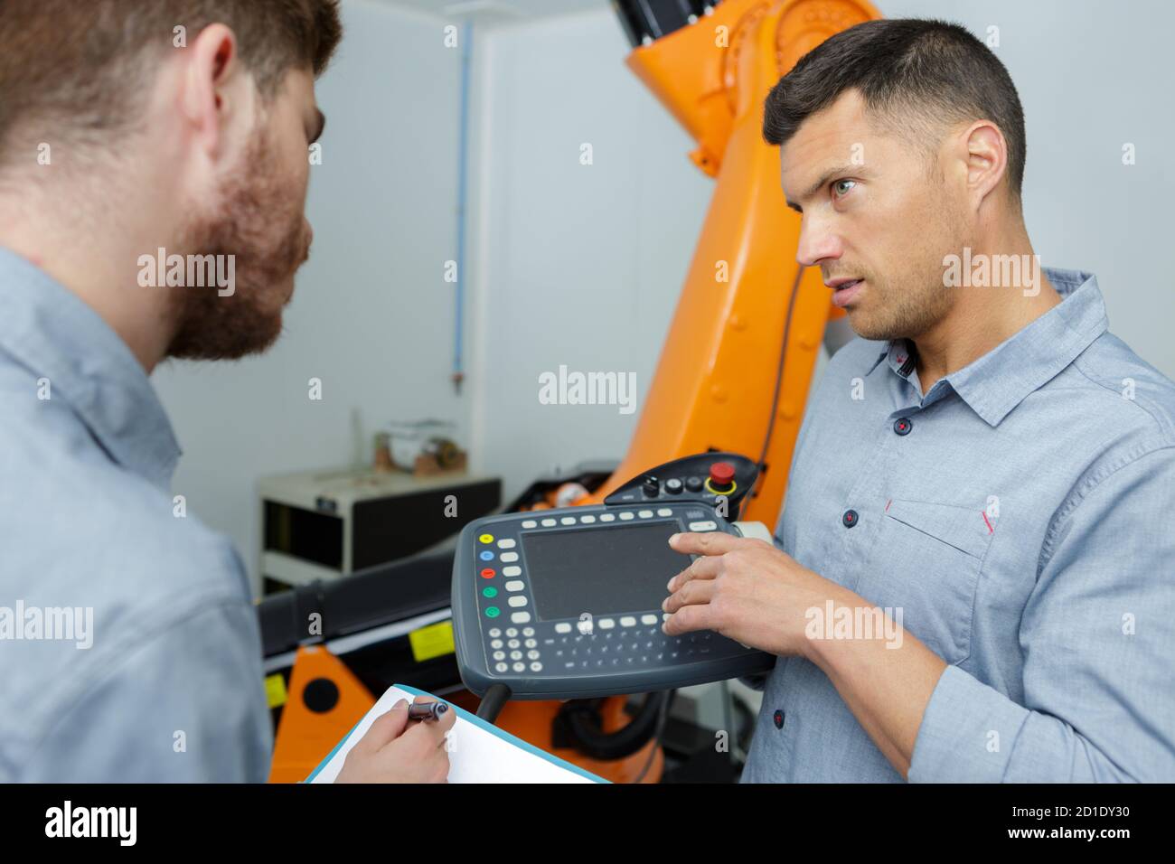 steel worker learning to use a machine Stock Photo - Alamy