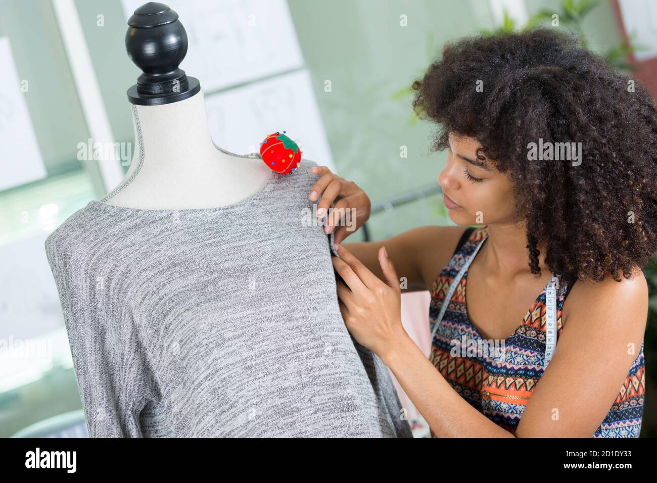 seamstress sewing formal suit in atelier Stock Photo - Alamy