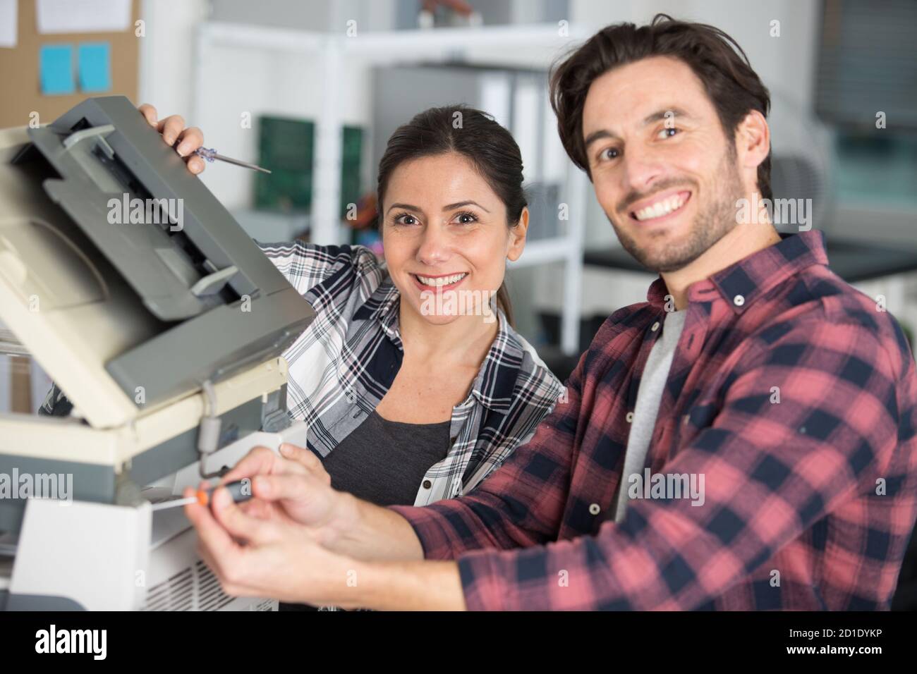 happy two workers and printer maintenance Stock Photo - Alamy