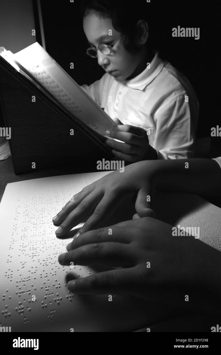 Girl reading braille book Black and White Stock Photos & Images - Alamy