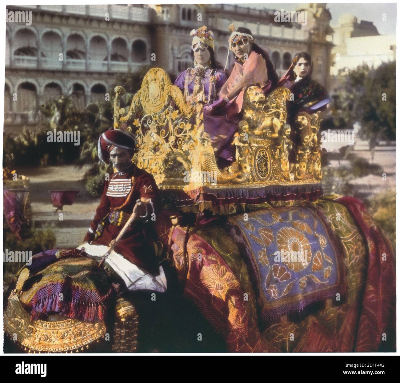 Colorized photo of three women, dressed in opulent attire, riding an ...