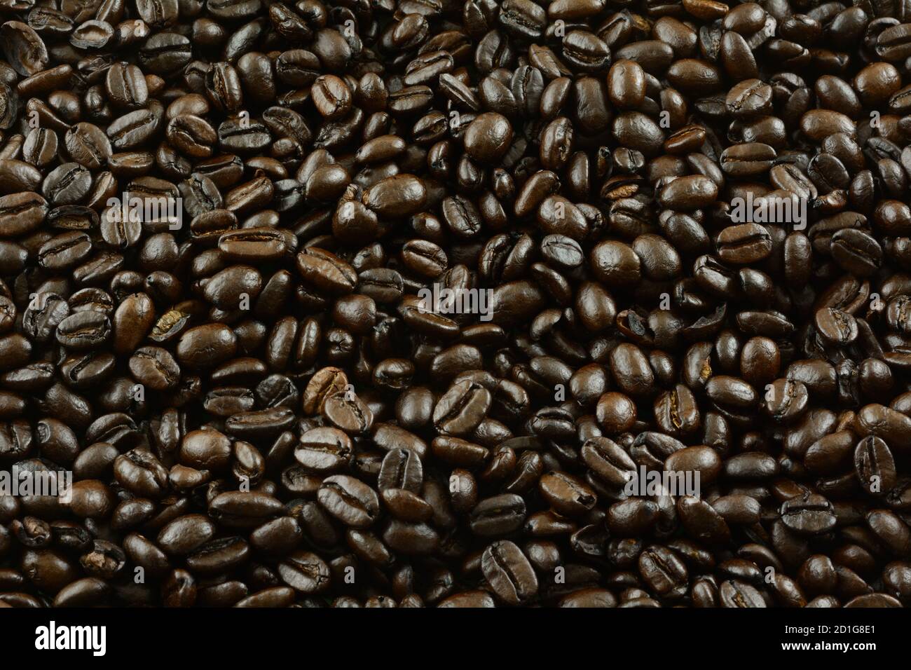Food background of closeup of extra dark French whole bean coffee Stock ...