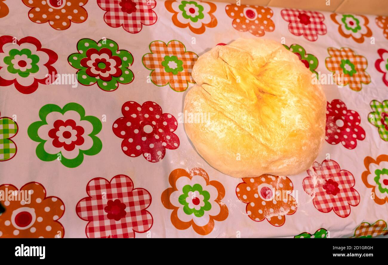 raw bread in the kitchen table of worker home before cook in the oven ...
