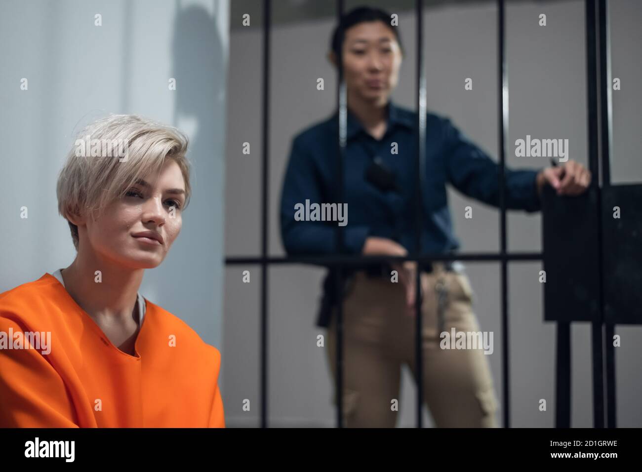 Portrait of a young prisoner in a uniform in a prison cell Stock Photo ...
