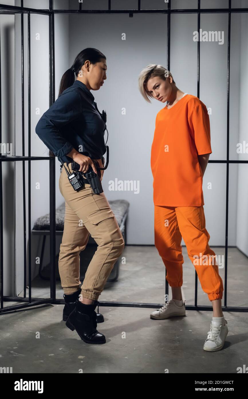 Shooting a movie about a women's prison. Backstage. Asian warden and a ...