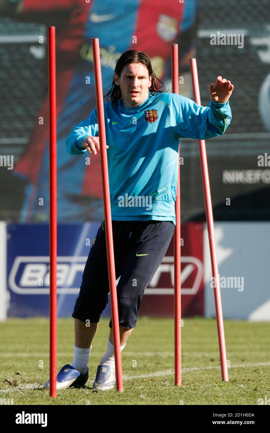 Barcelonas lionel messi attends training hi-res stock photography and ...