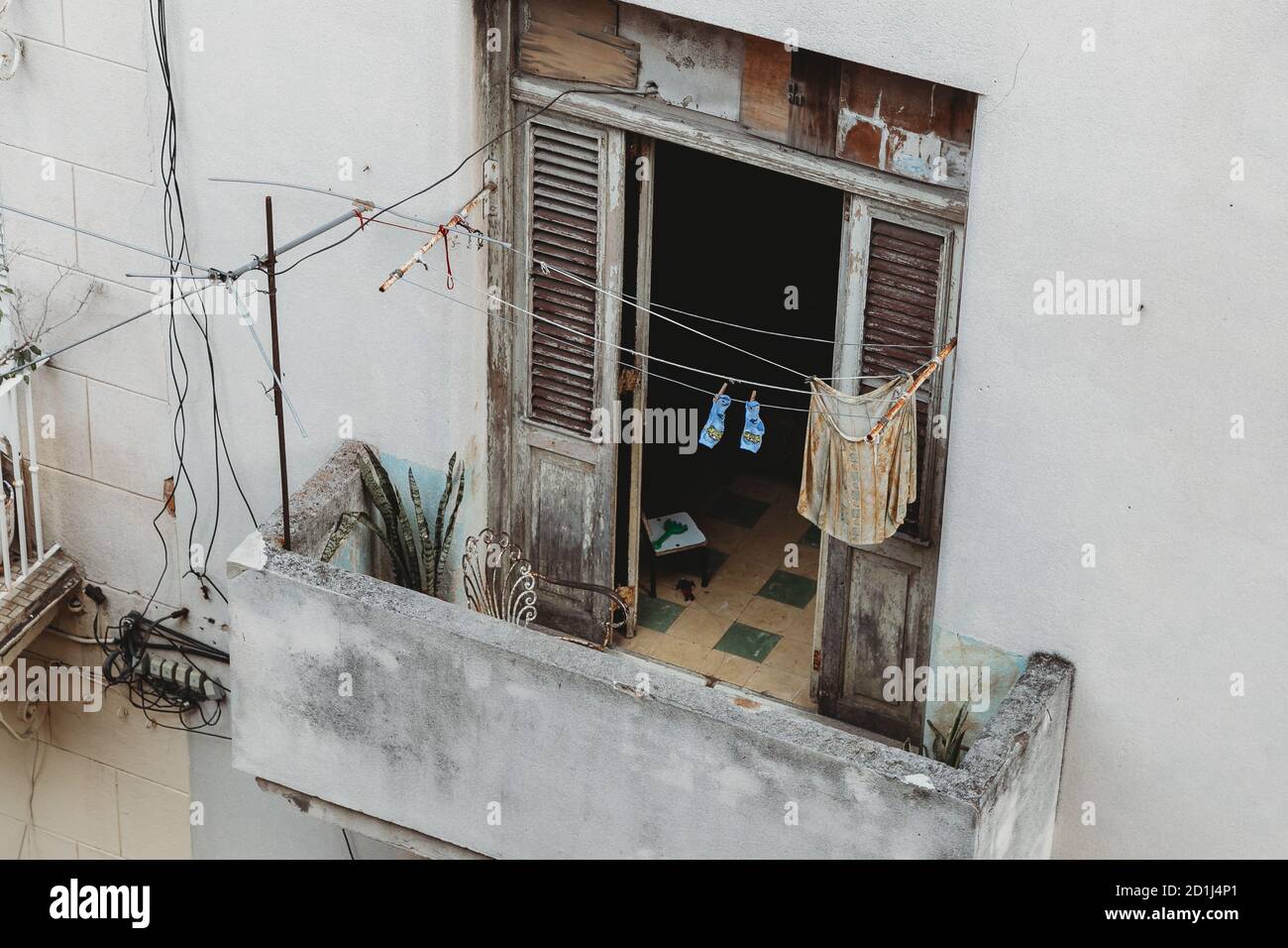 Balcony to a home of a Cuban family shows typical, poor living ...