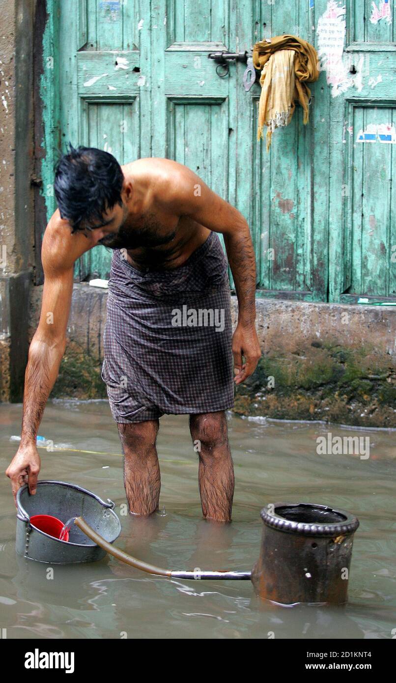 Indian man in drainage water hi-res stock photography and images - Alamy