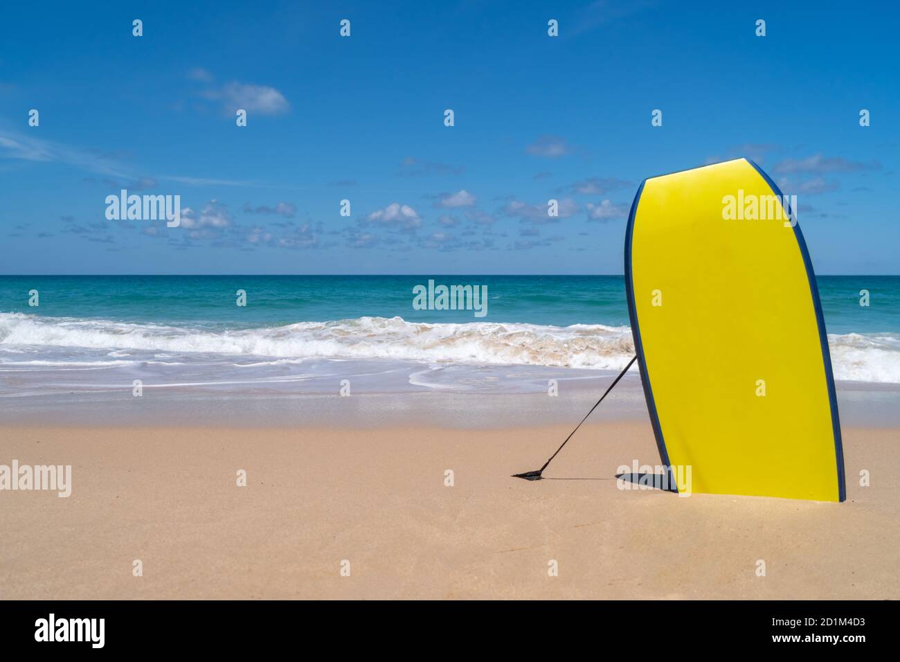 Small surfboards on sand at summer beach with sun light and blue sky ...