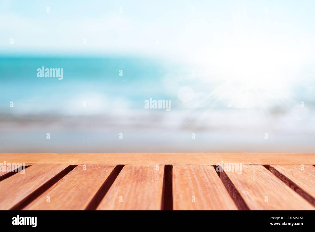 Selective focus of old wood table with blur beautiful beach background ...