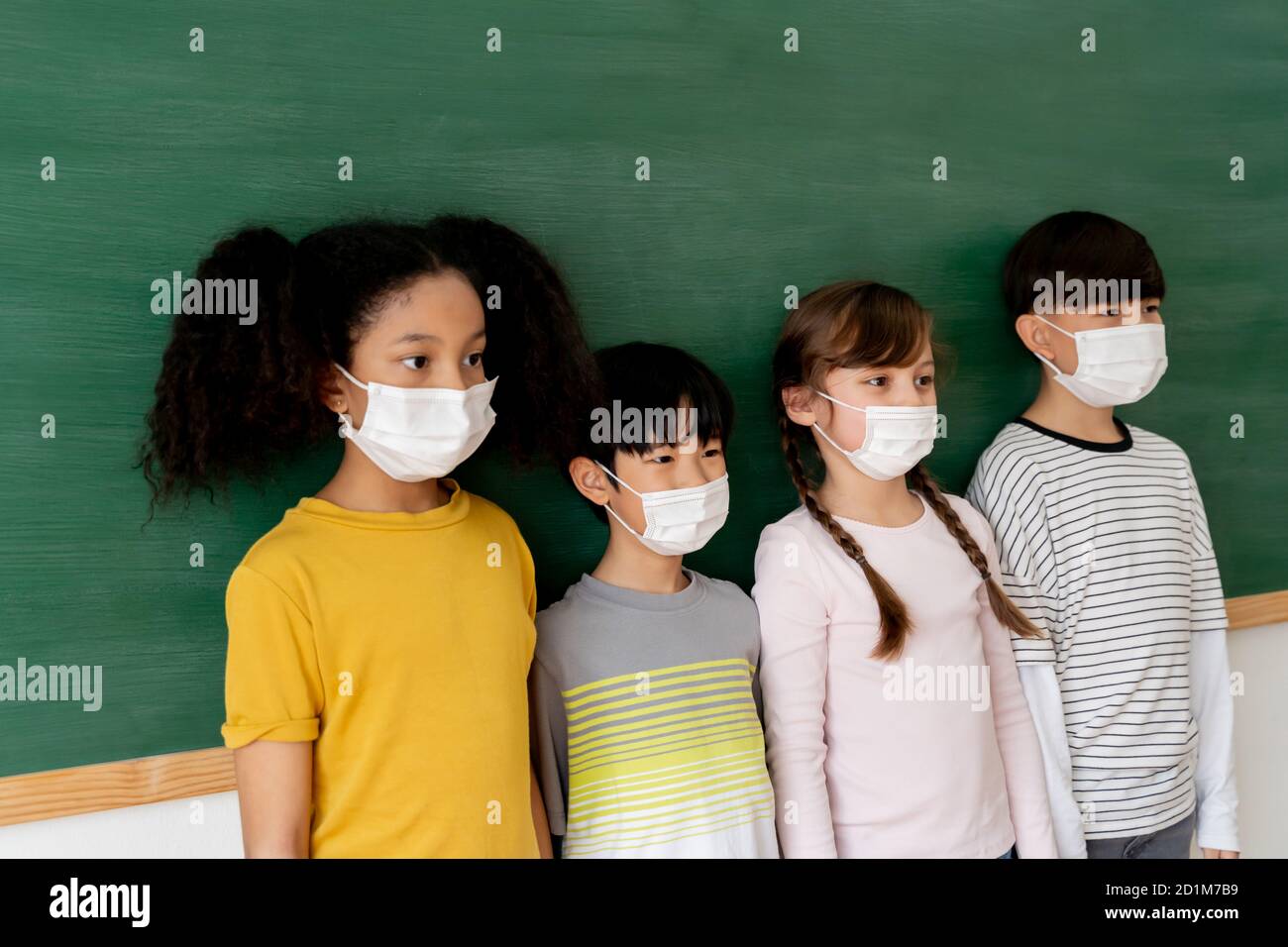 Group of diverse elementary students in classroom. Primary school multi ...