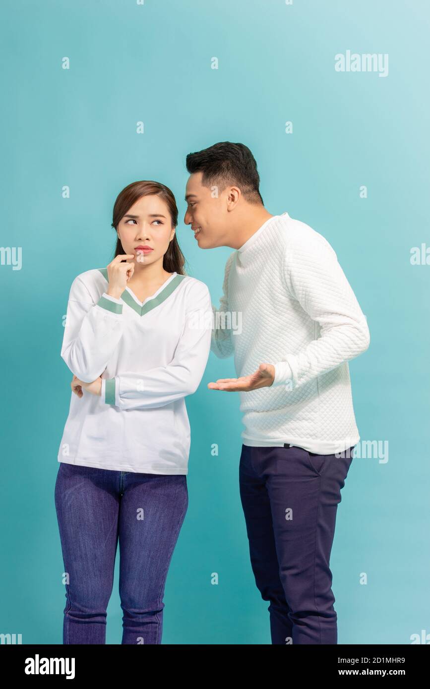 young Asian couple whisper, closeup portrait Stock Photo - Alamy
