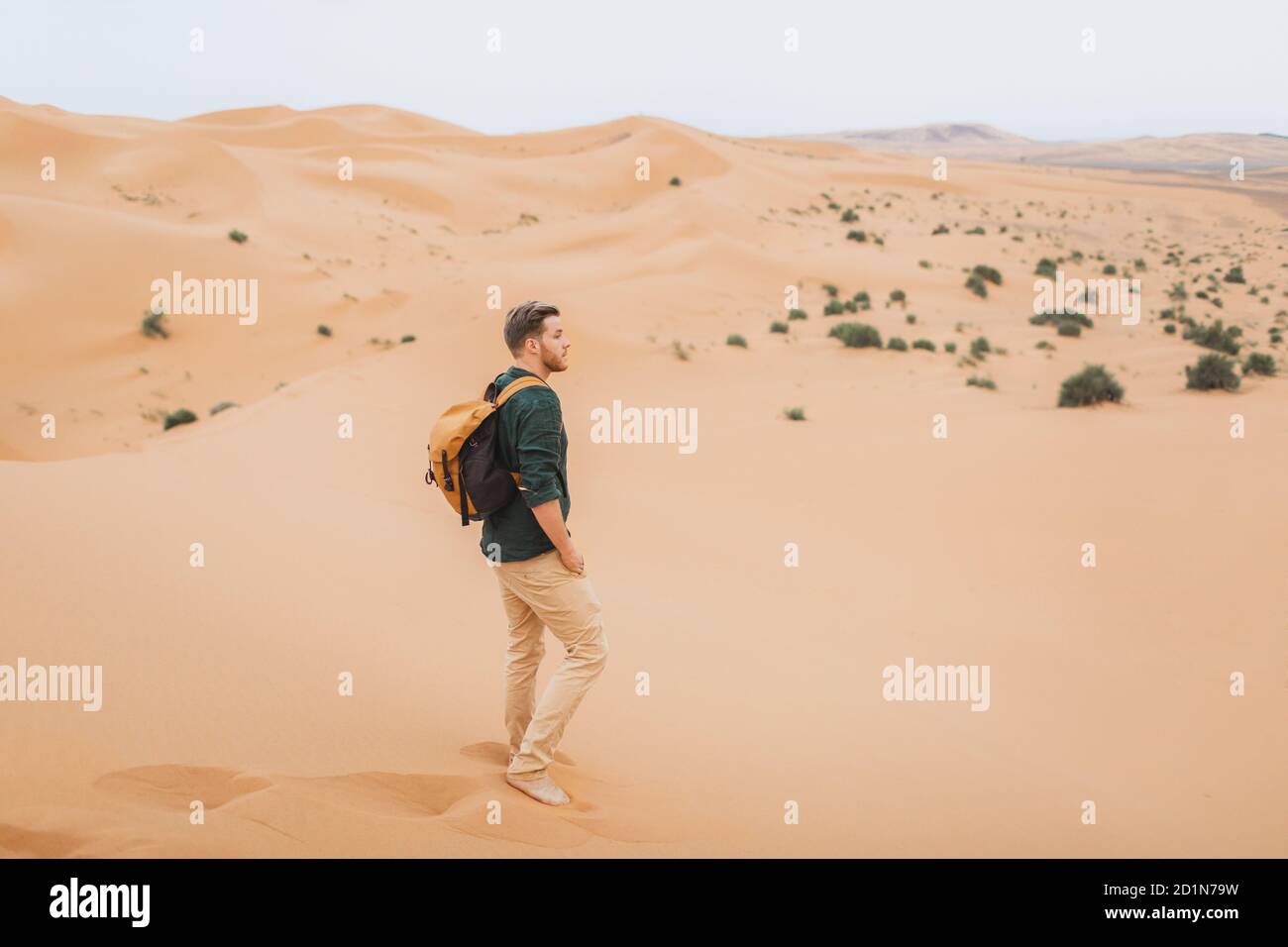 Man backpacker travel in Morocco, Sahara desert. Explore african nature ...