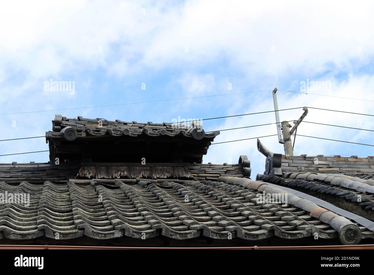 Japanese traditional roof style, with some carving, at one house Stock ...