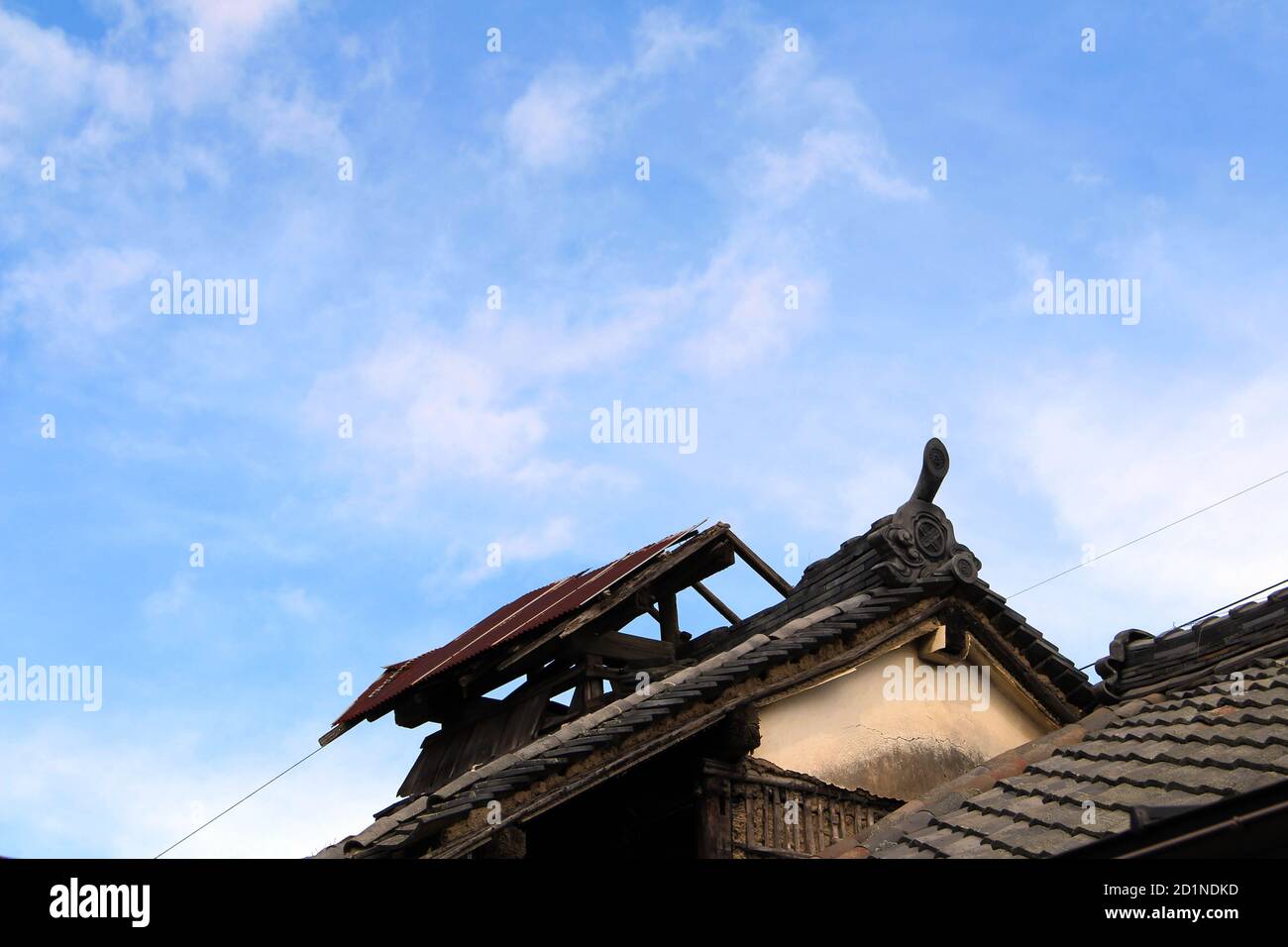 Japanese traditional roof style, with some carving, at one house Stock ...