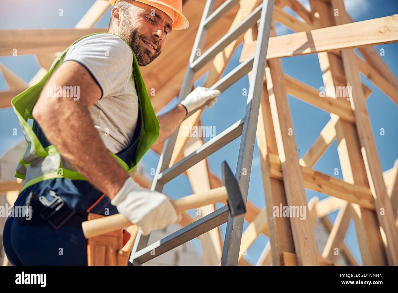 Strong constructor working on the building site Stock Photo - Alamy