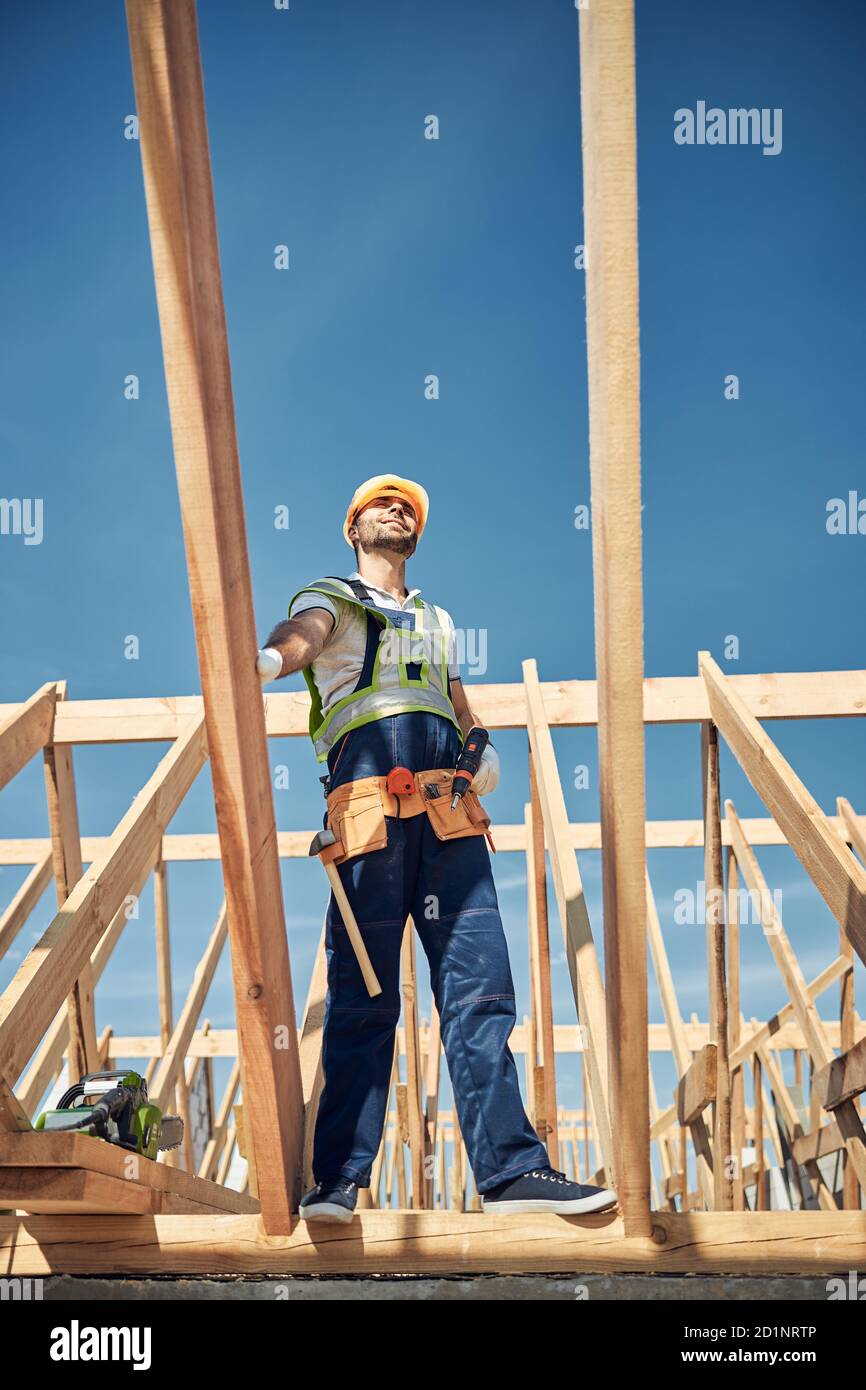 Kind male person standing on the beam Stock Photo - Alamy