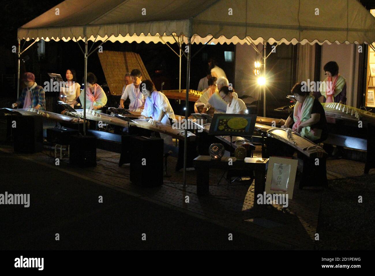 Local people of Asuka playing traditional musical instruments at night ...