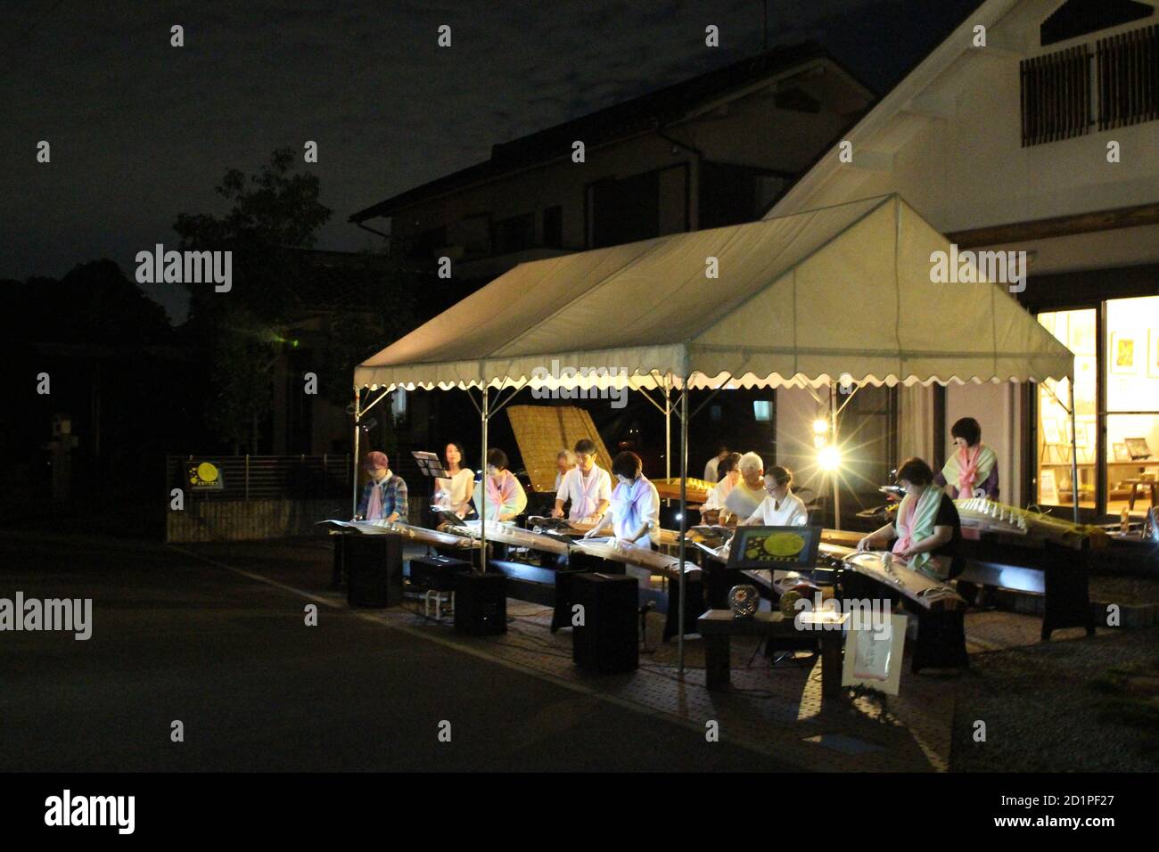Local people of Asuka playing traditional musical instruments at night ...