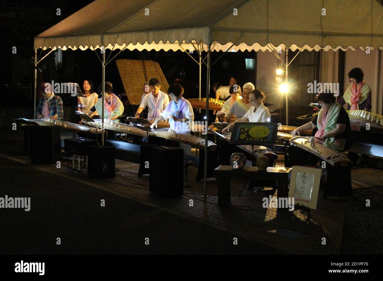 Local people of Asuka playing traditional musical instruments at night ...