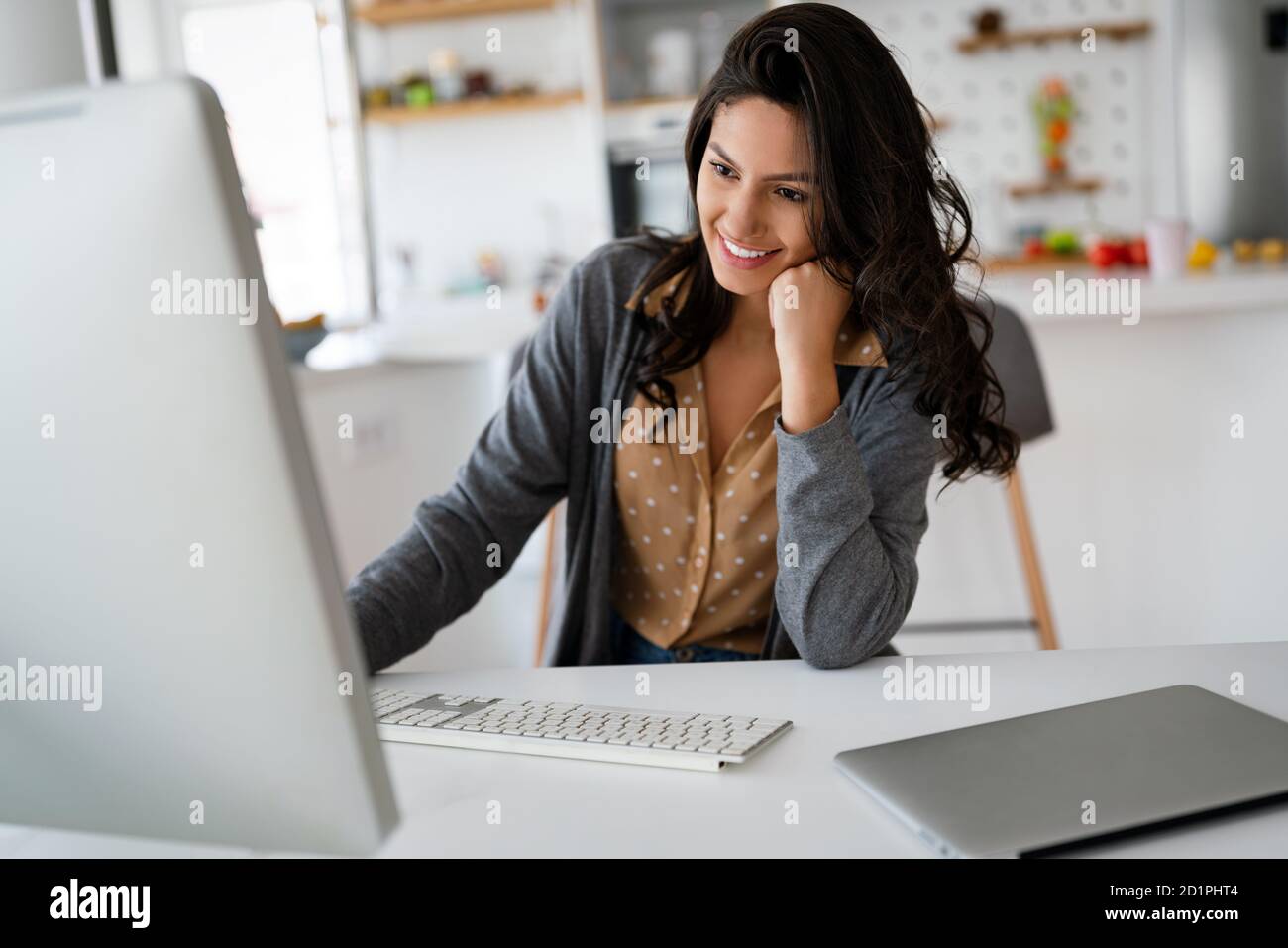 Attractive business woman working on computer. Business technology ...