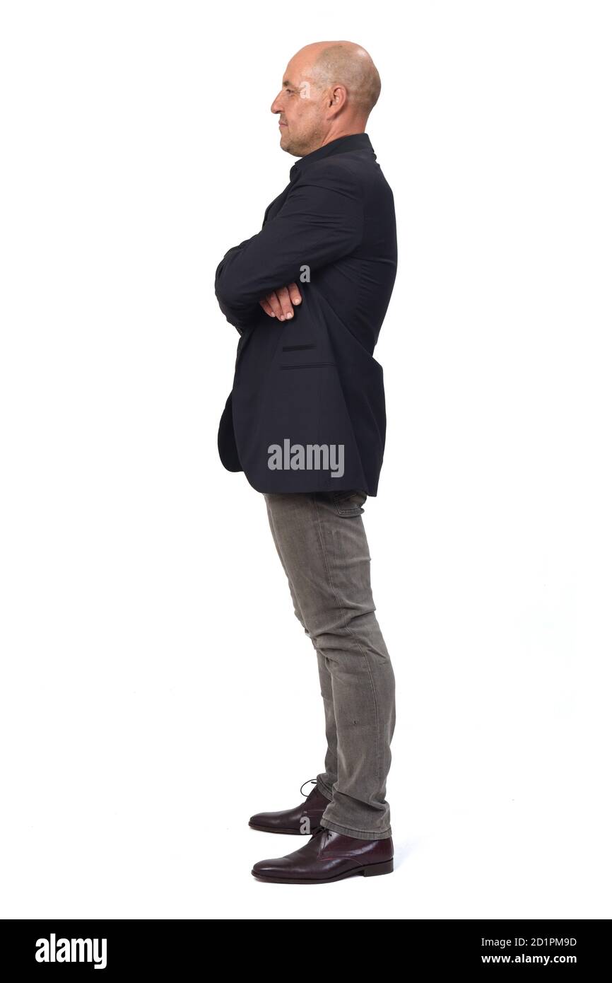 side view of a man with blazer on white background, arms crossed Stock ...