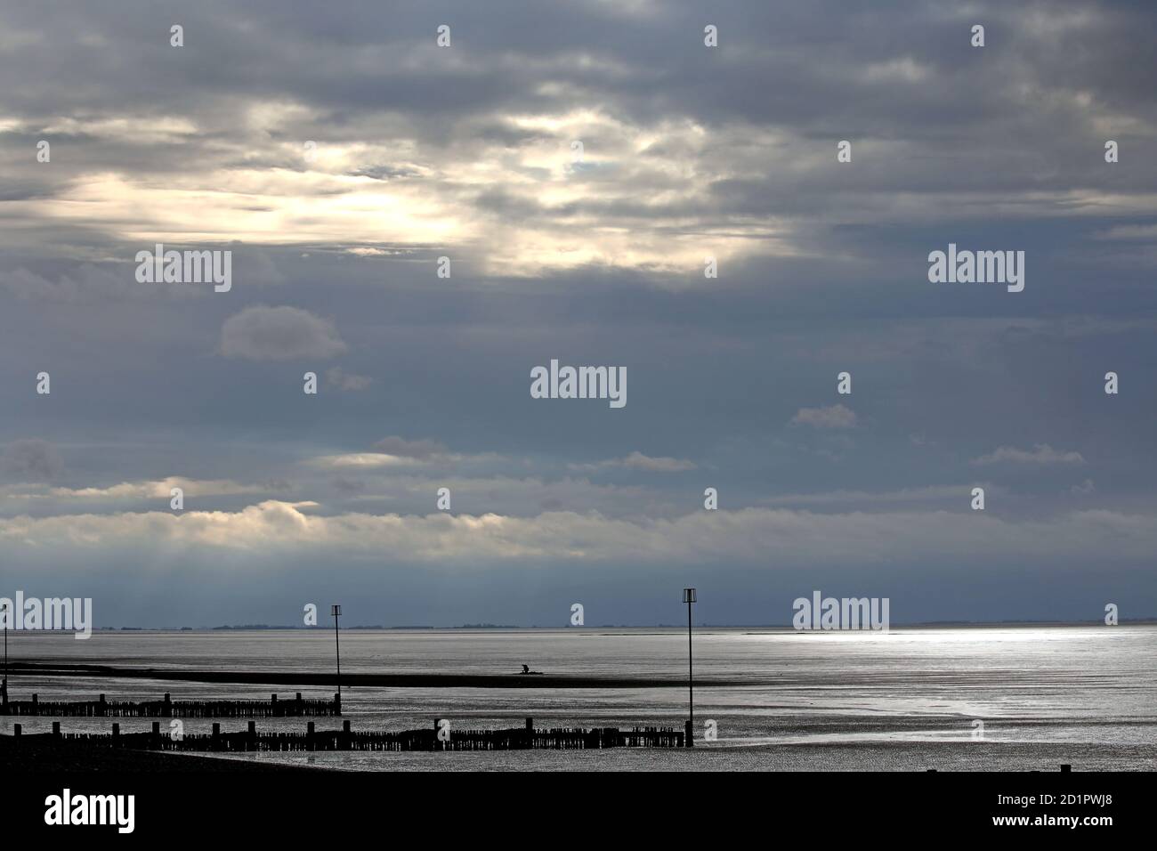 Heacham, UK. 05th Oct, 2020. A person searching for fishing bait on the ...