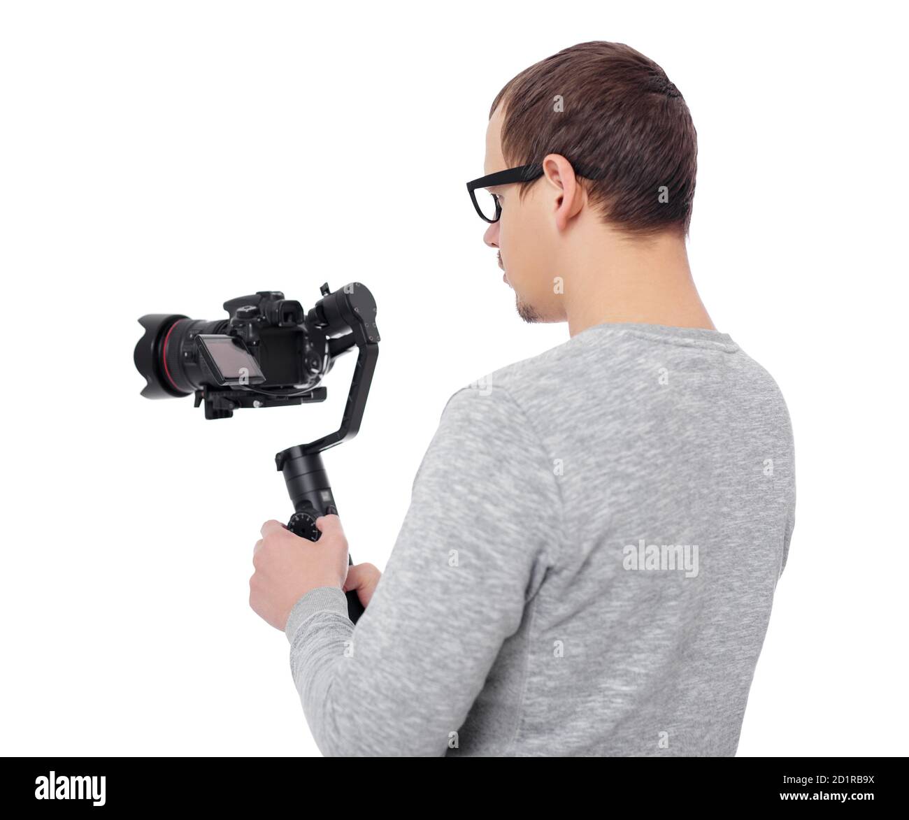 back view of professional videographer using dslr camera on gimbal ...