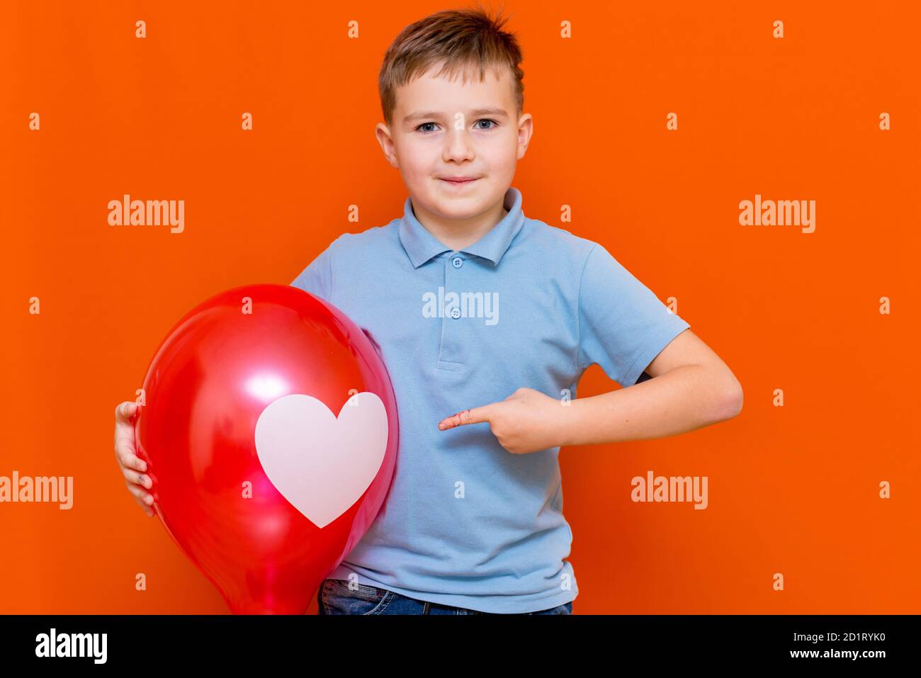 Close up Valentine's Day. Happy caucasian joyful young boy poke at a ...