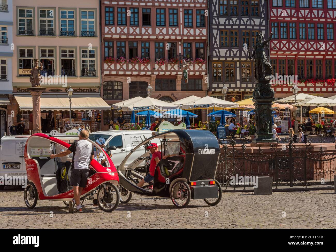 Rickshaw drivers with their vehicles on the Roemerberg waiting for ...