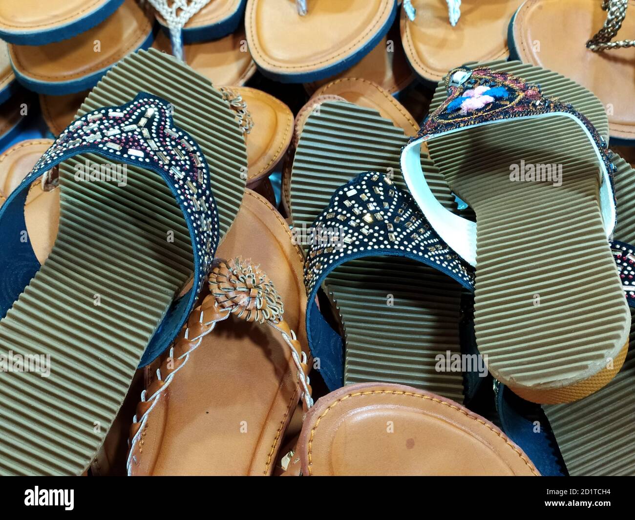 Pile of flip flops in a market with different designs in a market Stock ...