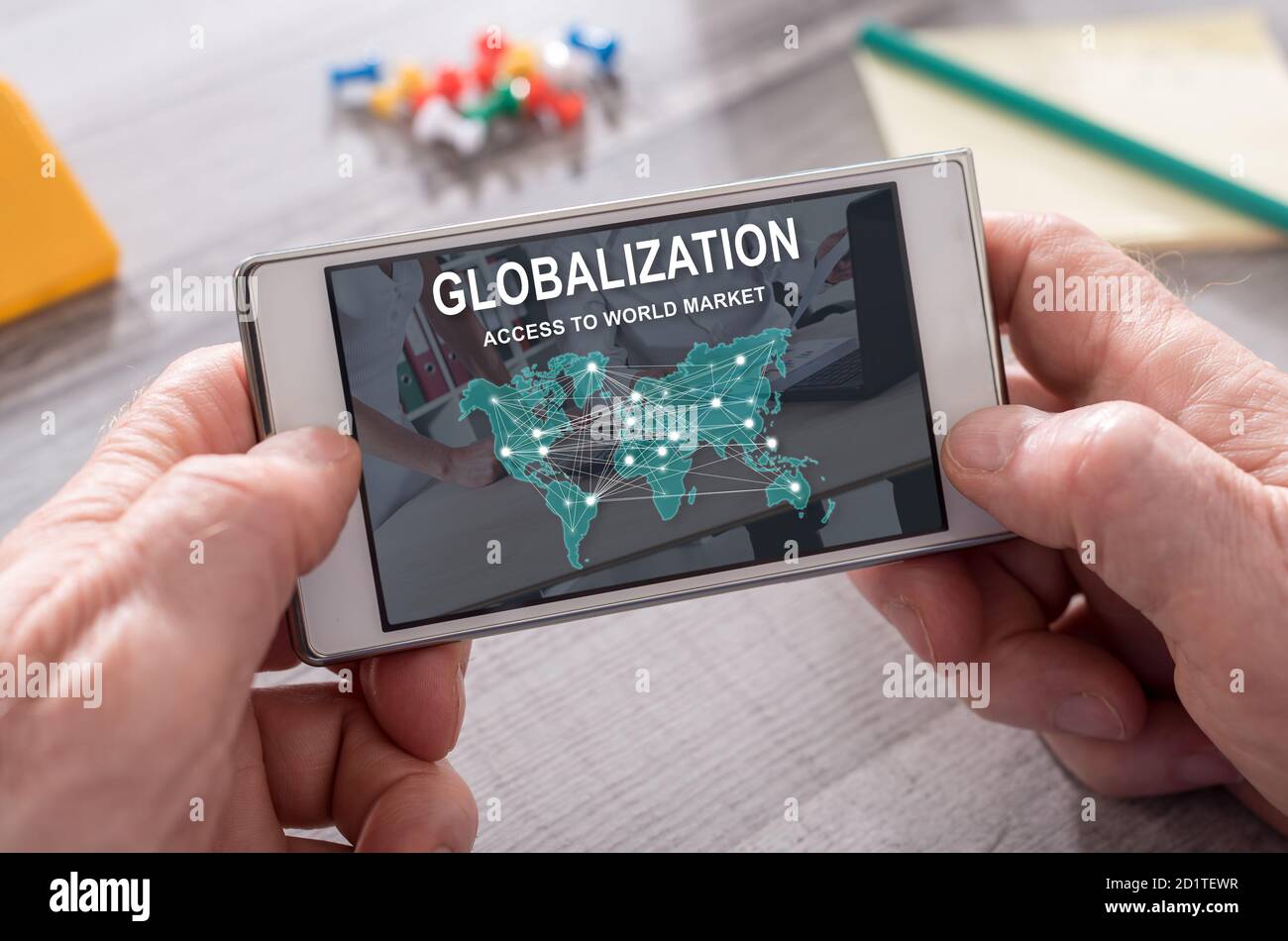 Globalization concept on mobile phone Stock Photo - Alamy