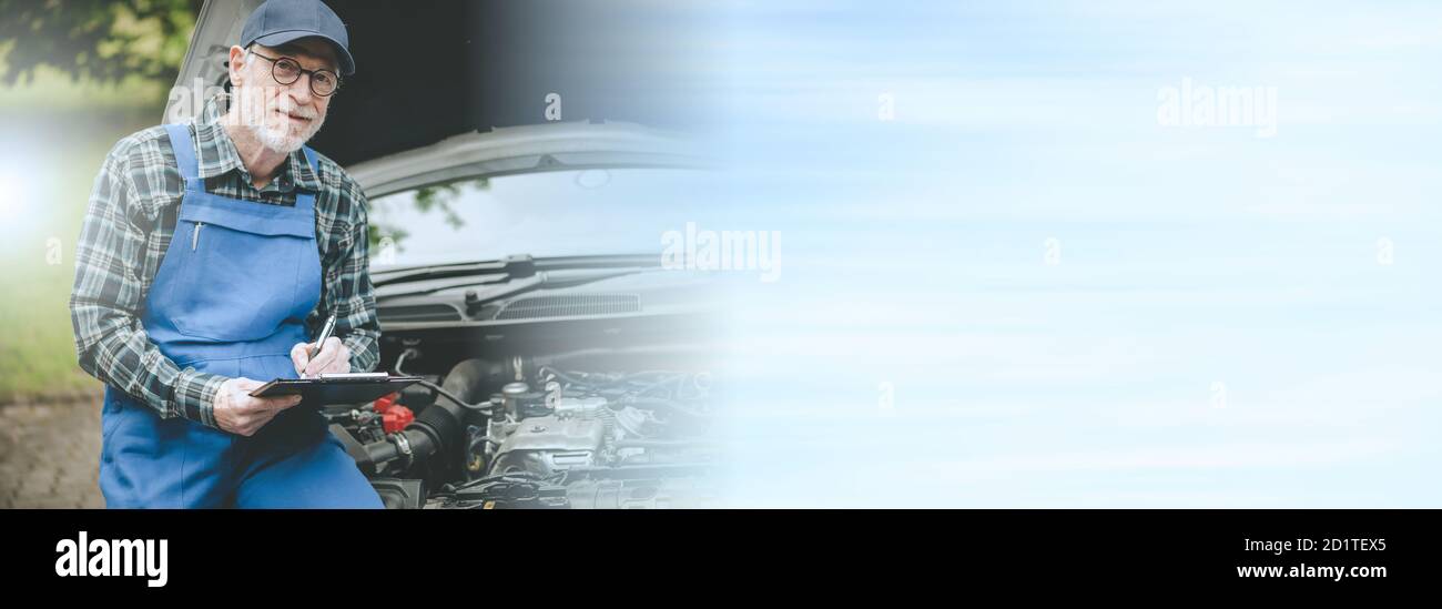 Car mechanic checking a car engine and writing on clipboard; panoramic ...
