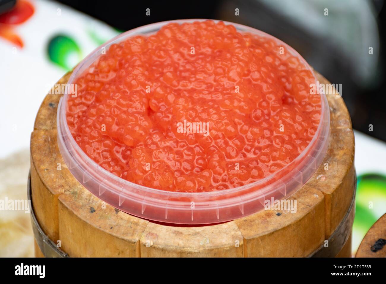 Salmon roe and sturgeon red caviar served in a wooden barrel ready to ...