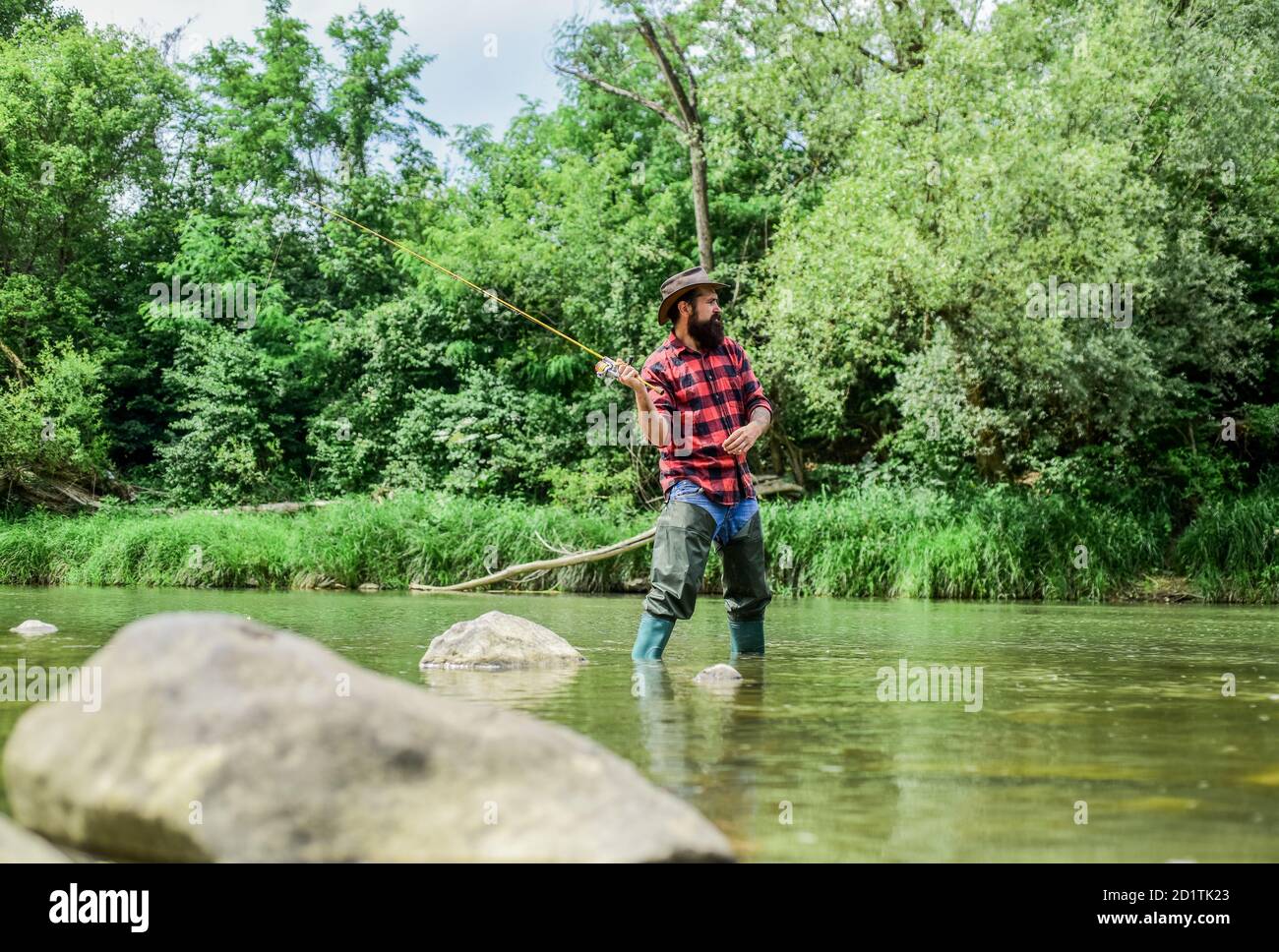 Experience the Legend. experienced fisher in water. man catching fish ...