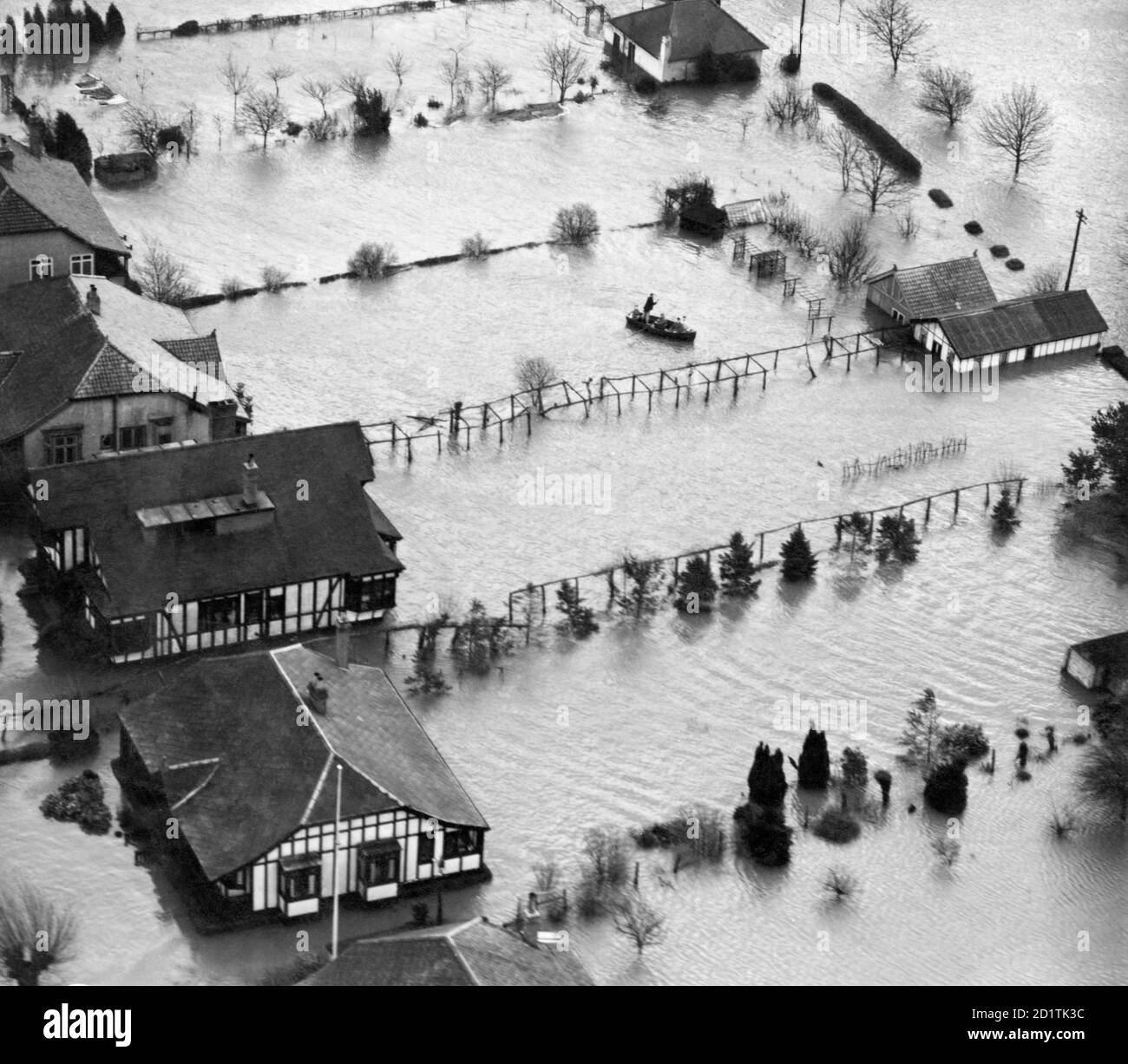 People in Boats. Aerial view. A boat in the flooded riverside garden ...