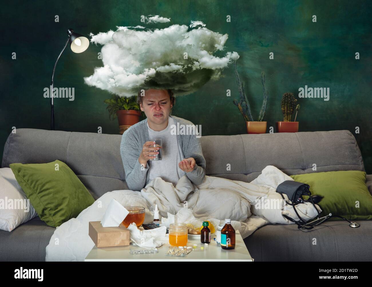 Pills. Ill young girl with fever and cold feeling sick, blue, snuffling ...