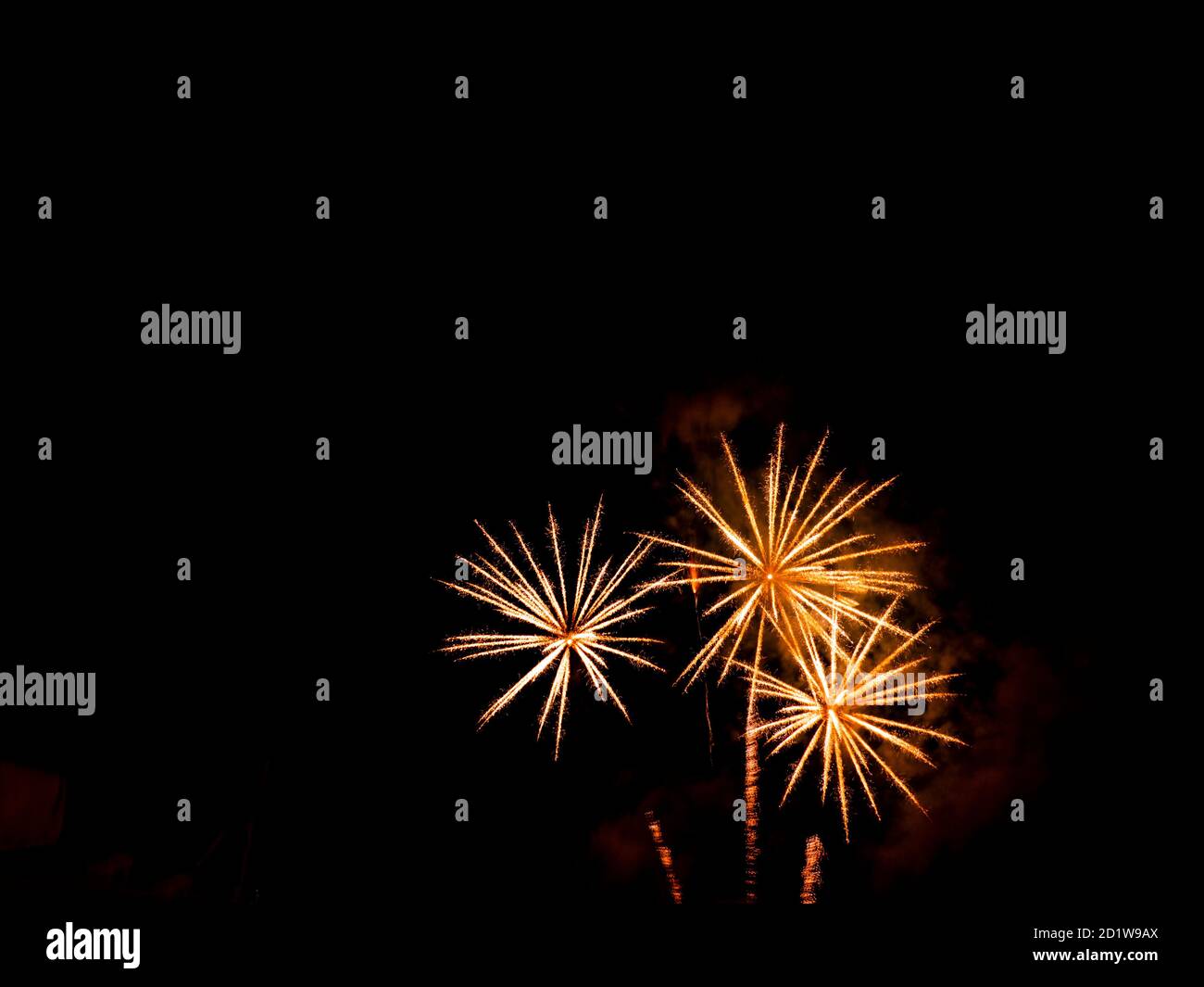 Burning sparklers on black background. Small fireworks giving off ...