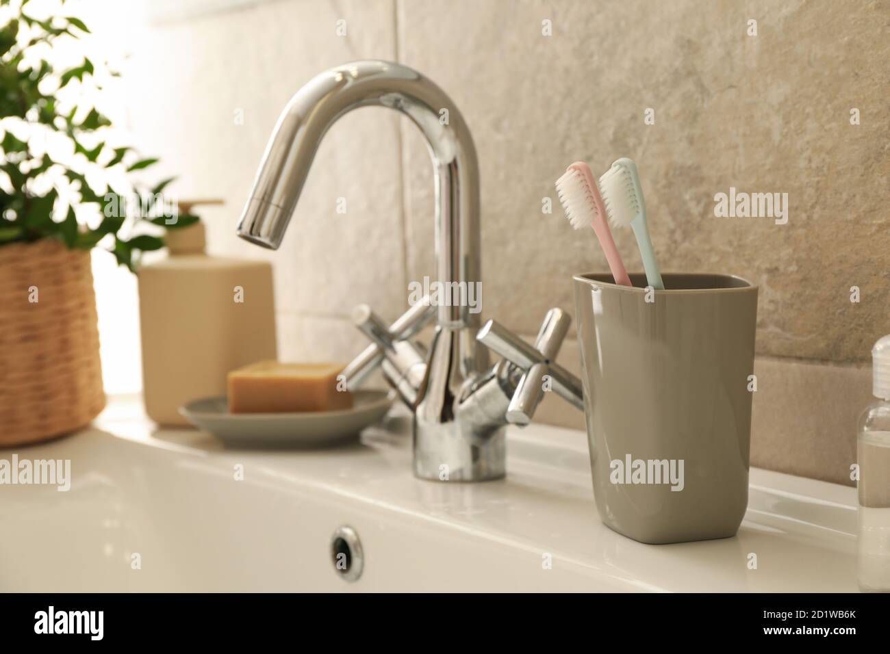 Sink and personal hygiene accessories in bathroom Stock Photo - Alamy