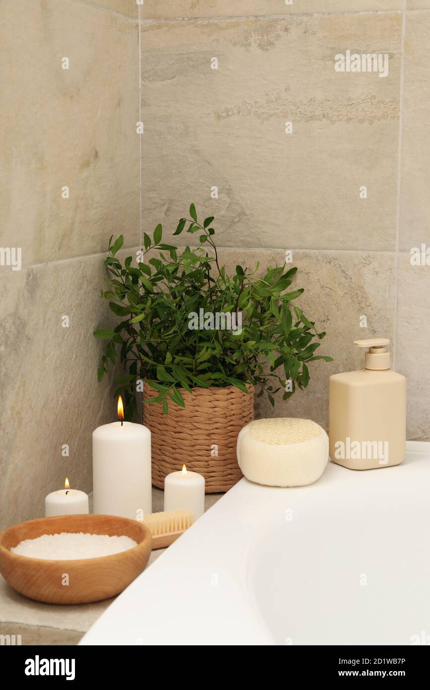 Bath with personal hygiene accessories in light beige bathroom Stock ...