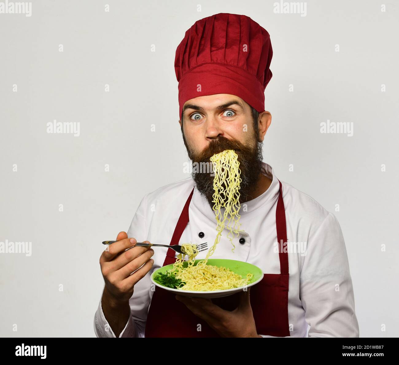 Man with beard holds tasty dish on white background. Fast food concept ...